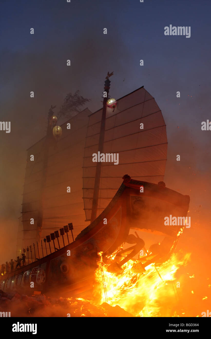 wood boat burning for a taiwanese festival Stock Photo - Alamy