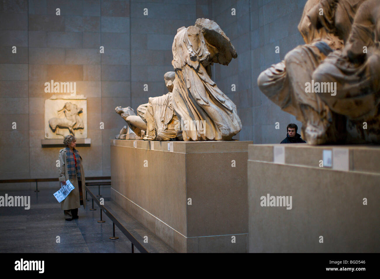 Tourists viewing the pediment sculptures from the Parthenon known as the Elgin Marbles in the ...