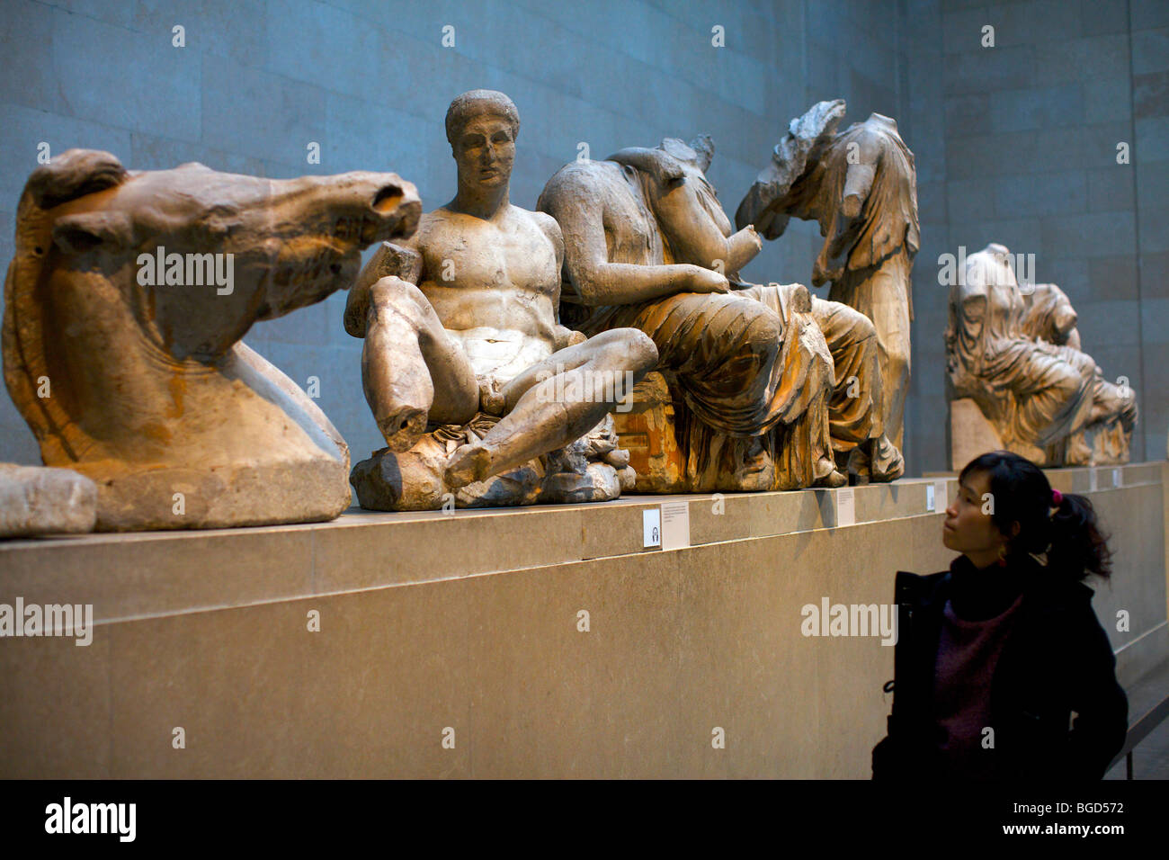 Tourists viewing the pediment sculptures from the Parthenon known as the Elgin Marbles in the ...