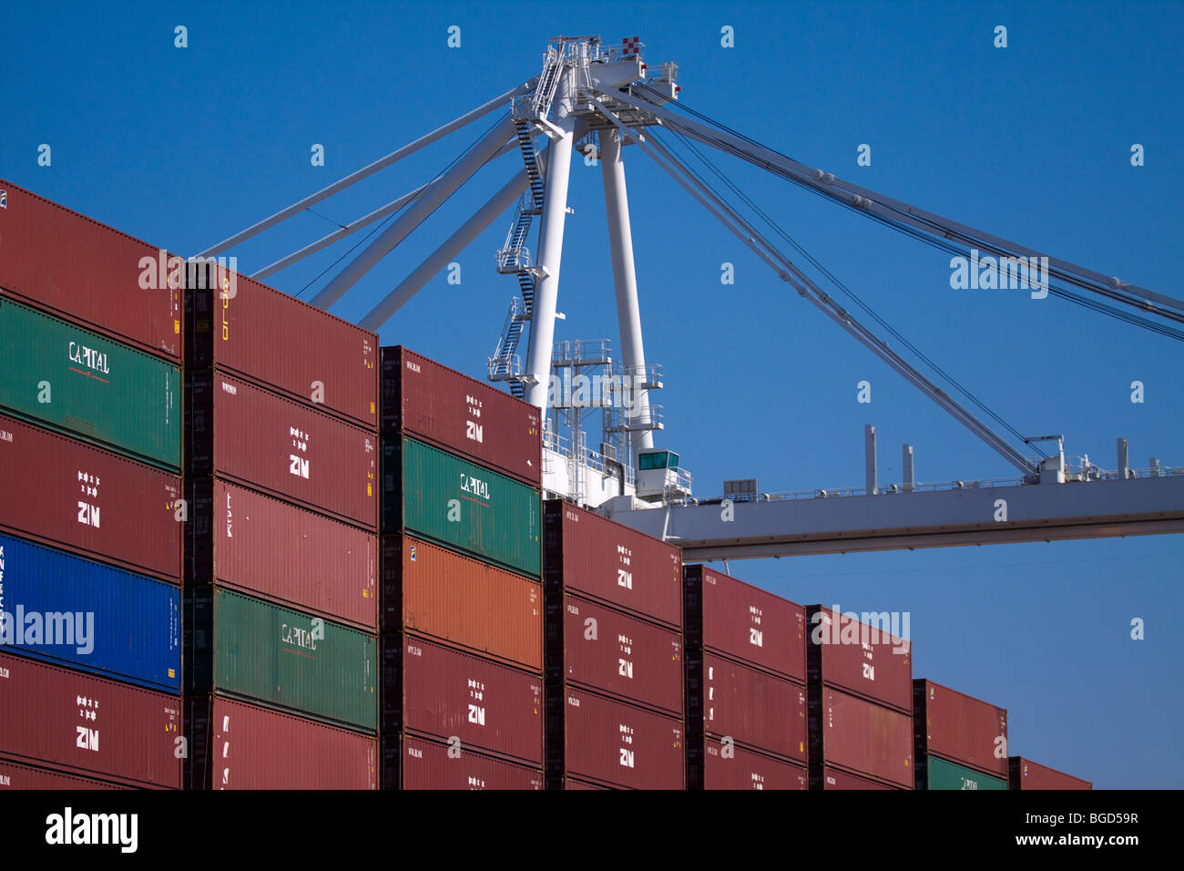 Crane and stacks of portainers on a cargo container ship Stock Photo ...