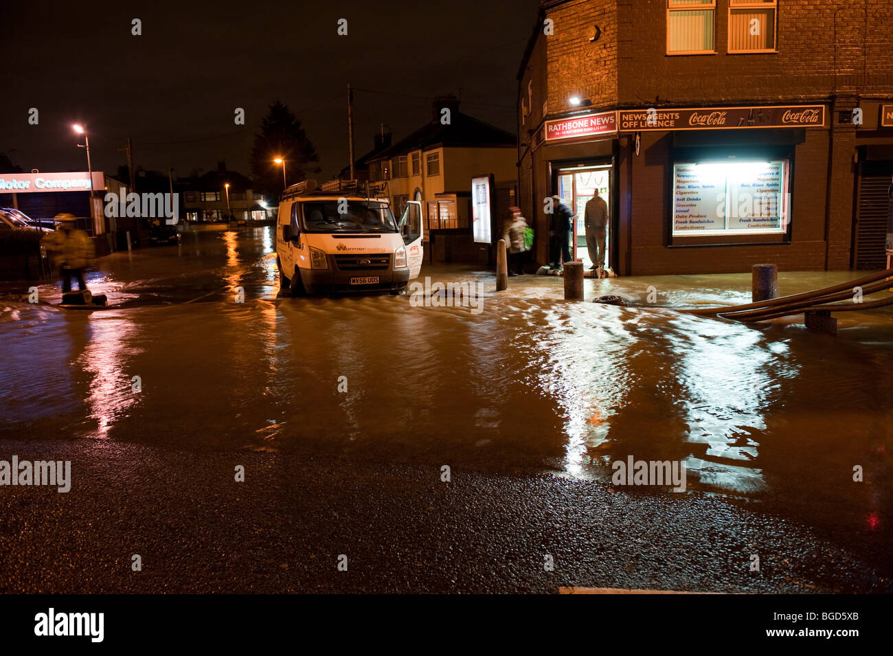 Flooding outside newsagents shop at night Stock Photo - Alamy