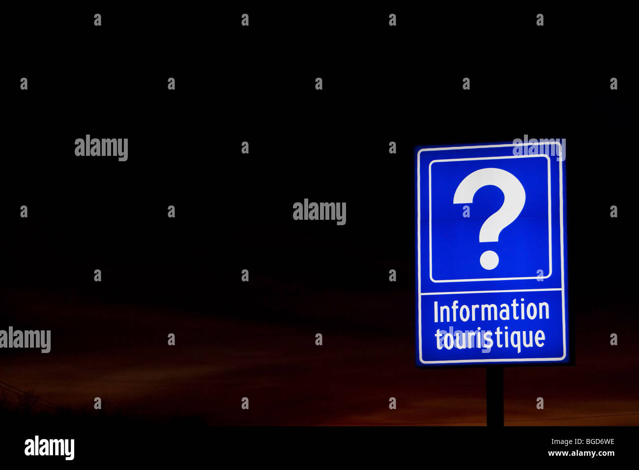 "information touristique" (tourist information) sign is silhouetted as ...