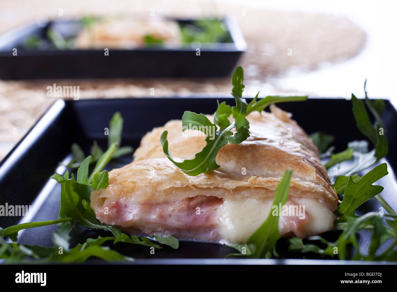 Mortadella ham and Edam cheese flan with fresh rucola salad on top ...