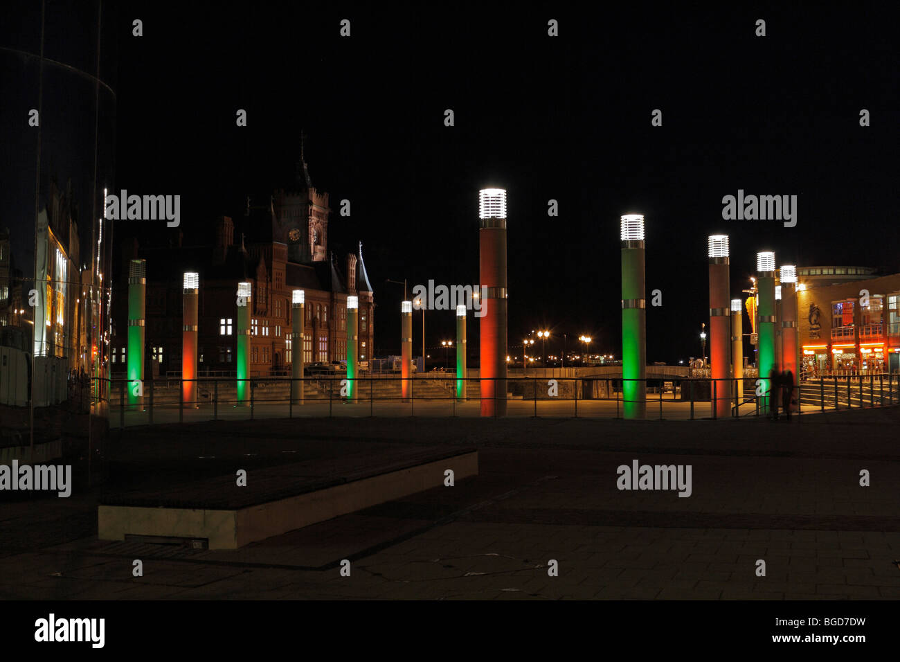Night time view of the Oval Basin in Cardiff Bay showing illuminated ...