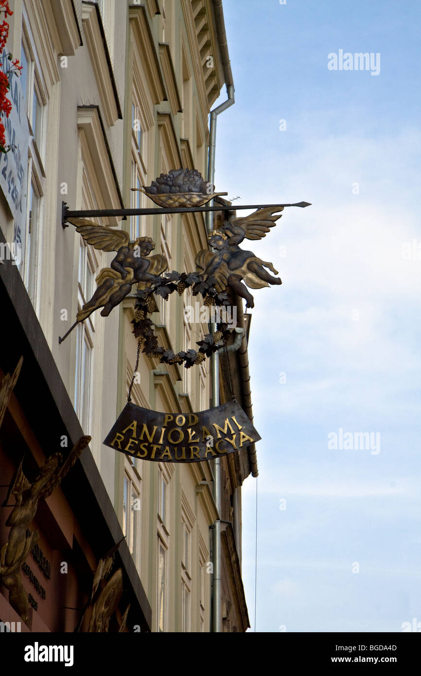 Shop sign advertising a restaurant hanging from the outside wall Stock ...