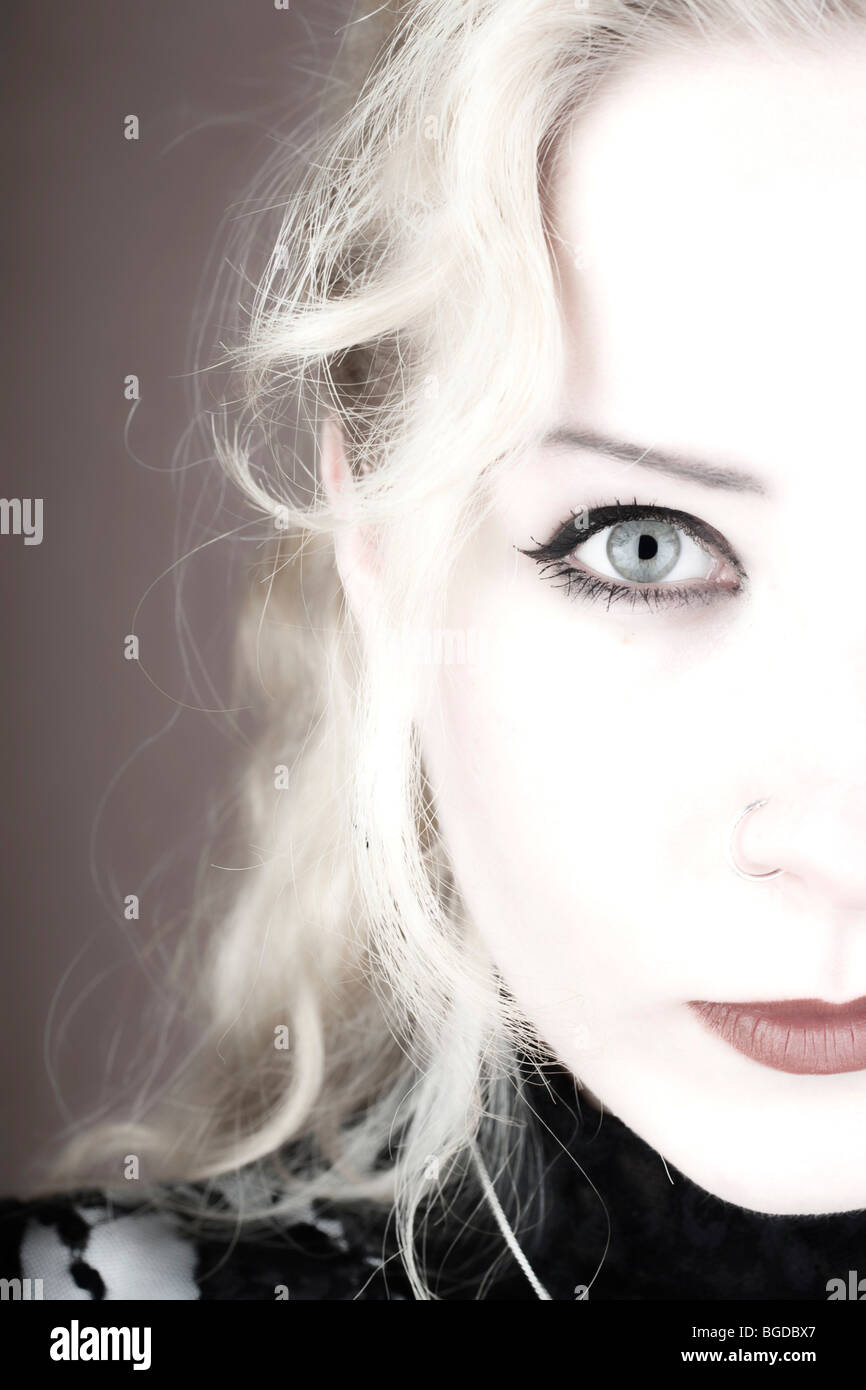 Young woman, blond, Gothic style with a serious expression on her face ...