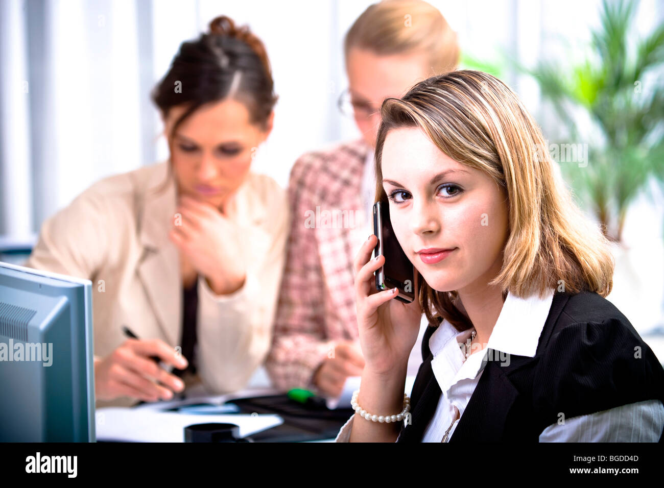 Portrait woman colleague using cell phone office hi-res stock ...