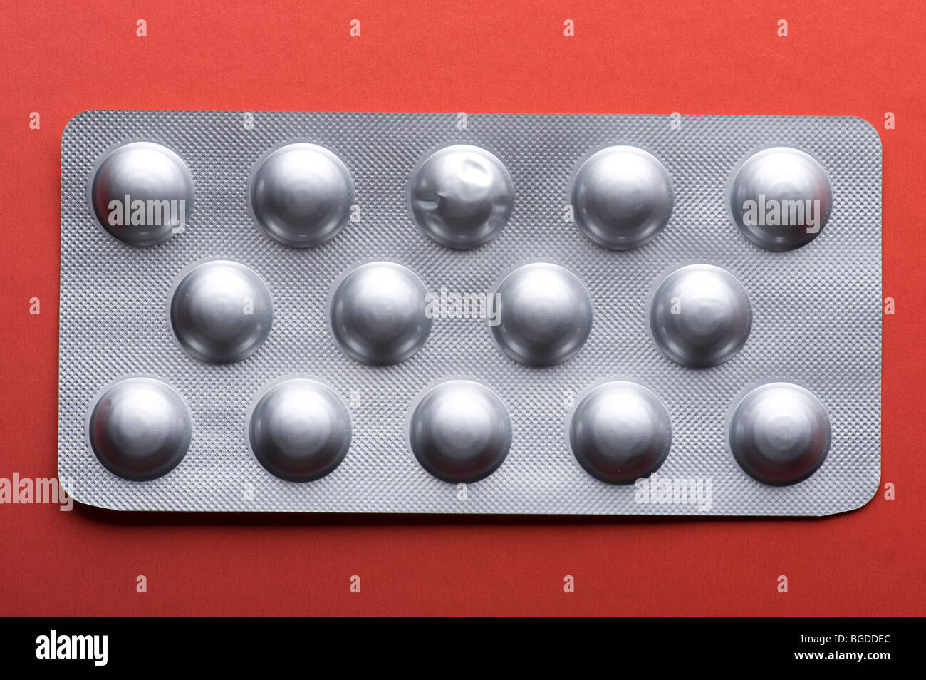 object on red - medical Tablet close up Stock Photo - Alamy