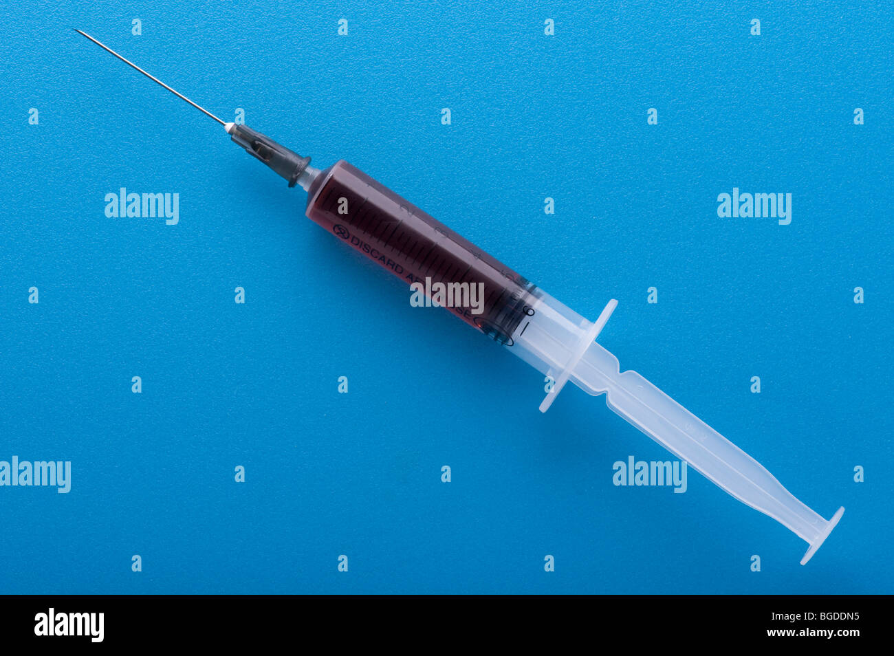 object on blue - medical syringe close up Stock Photo - Alamy