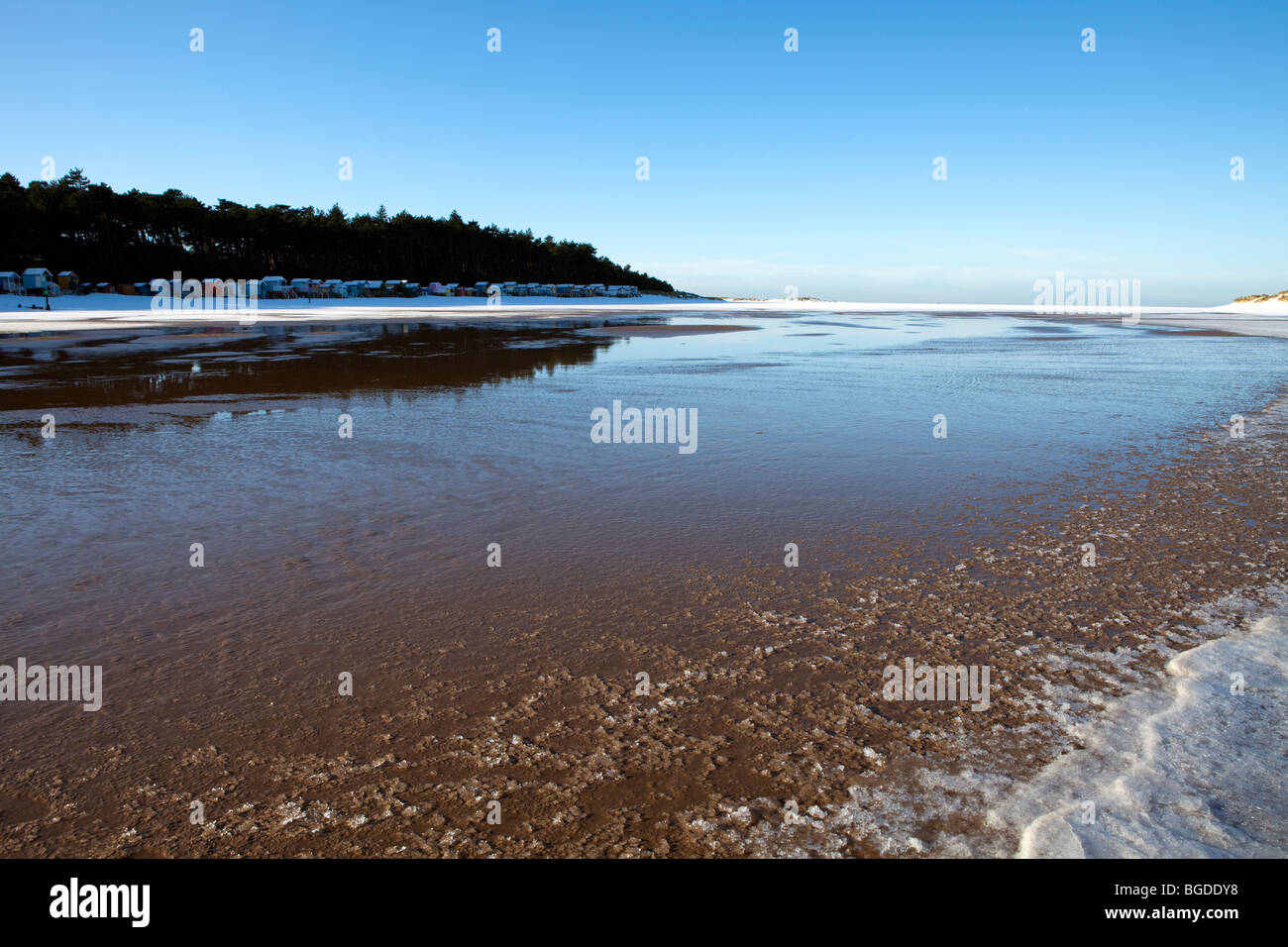 A Hint of Sunshine on Snowy Beach Stock Photo - Alamy