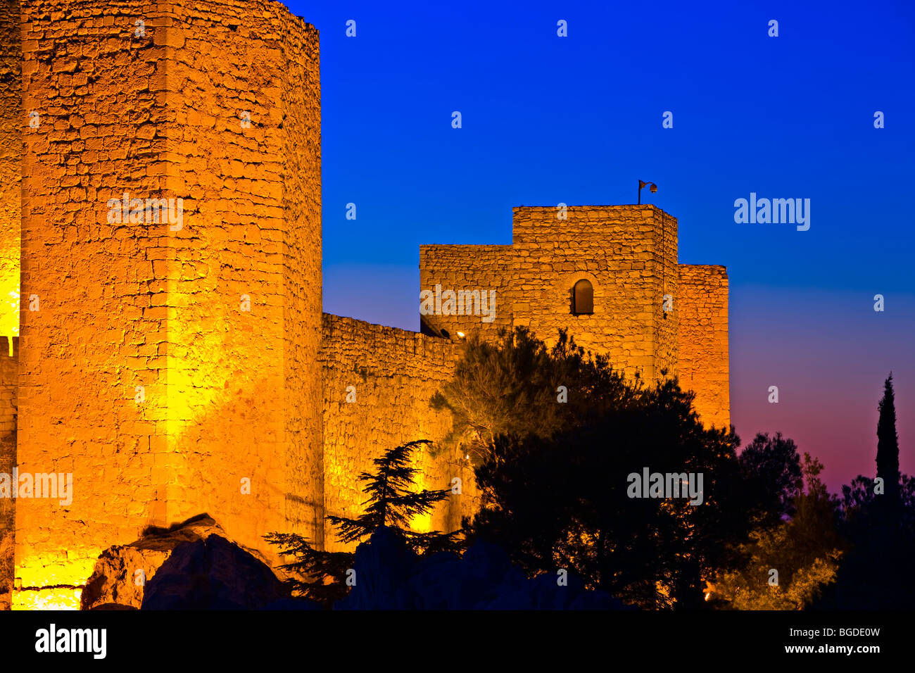 Walls and towers of the Castillo de Santa Catalina (Castle) at dusk in ...
