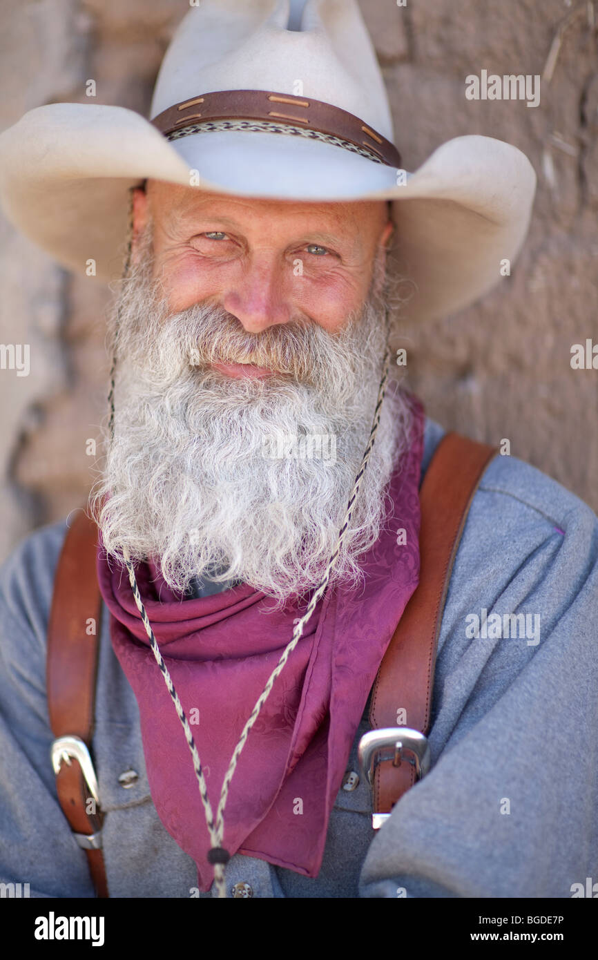 A cowboy with a white beard looking at camera Stock Photo - Alamy