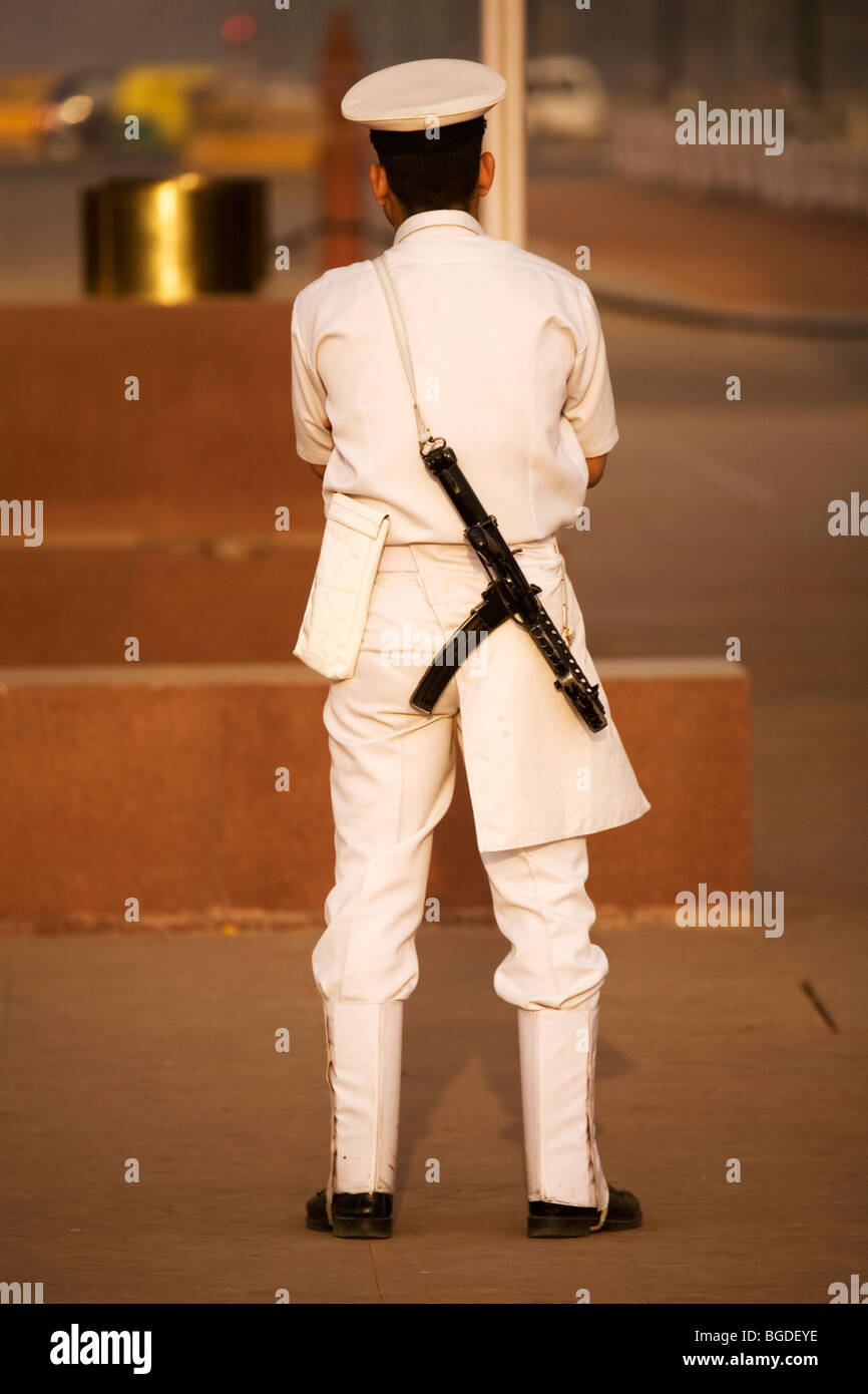 A guard stands with a submachine gun at the India Gate in New Delhi ...