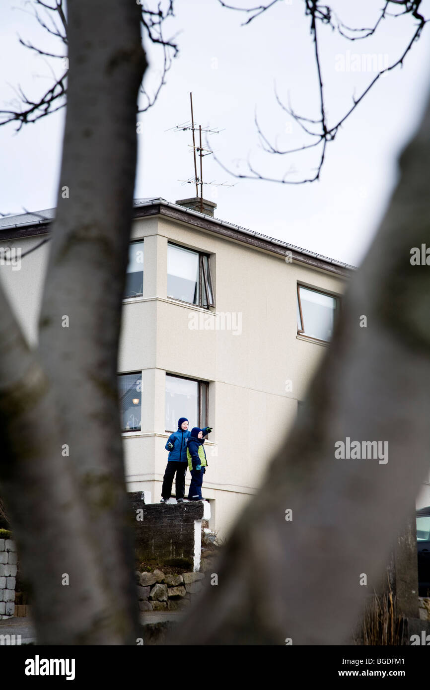 Two boys outside their house. Hafnarfjordur, Greater Reykjavik Area ...
