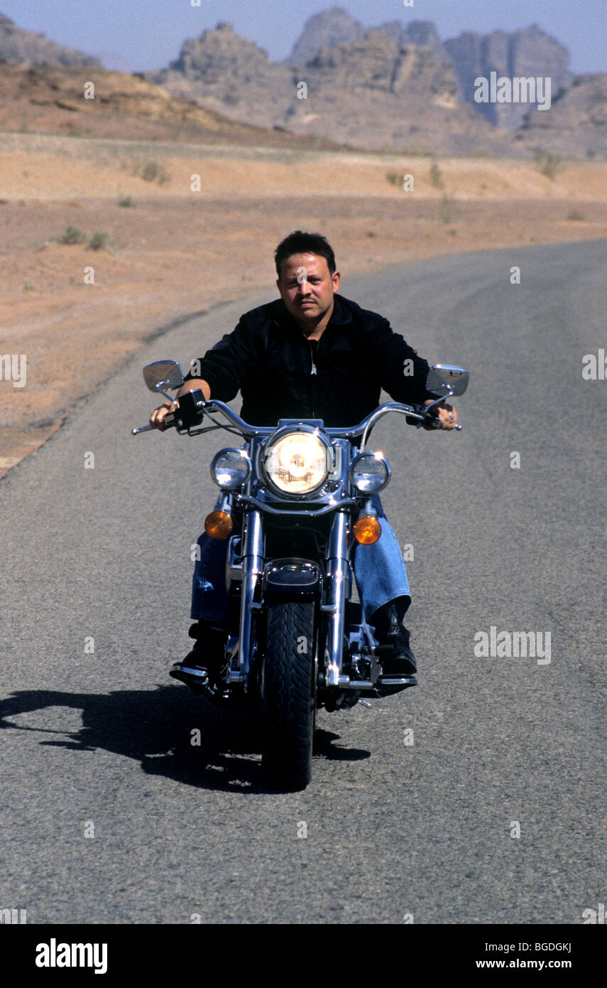 King Abdullah II of Jordan riding his motorcycle in Wadi Rum Stock ...