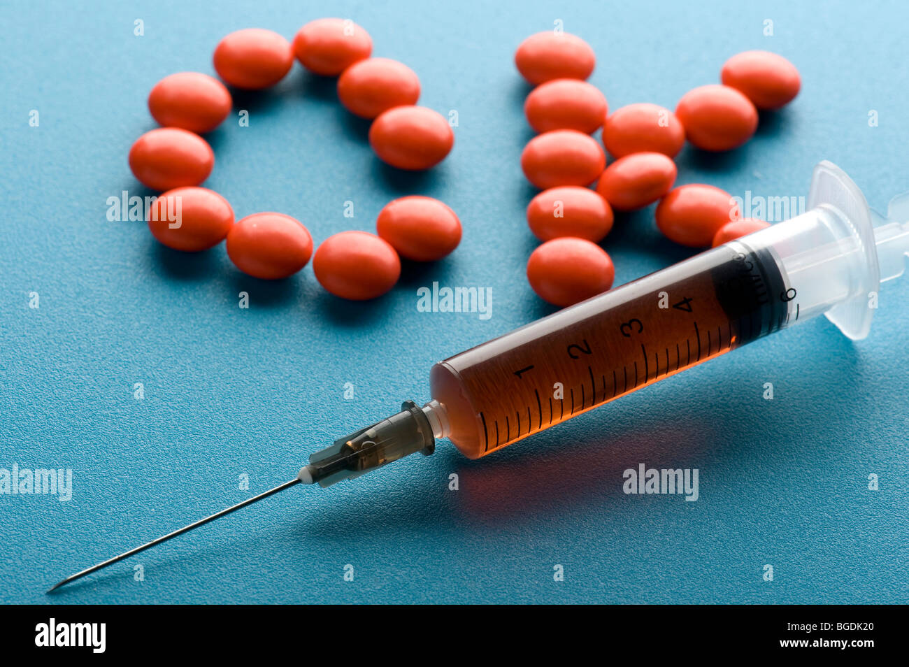 object on blue- Medical Tablet and syringe close up Stock Photo - Alamy