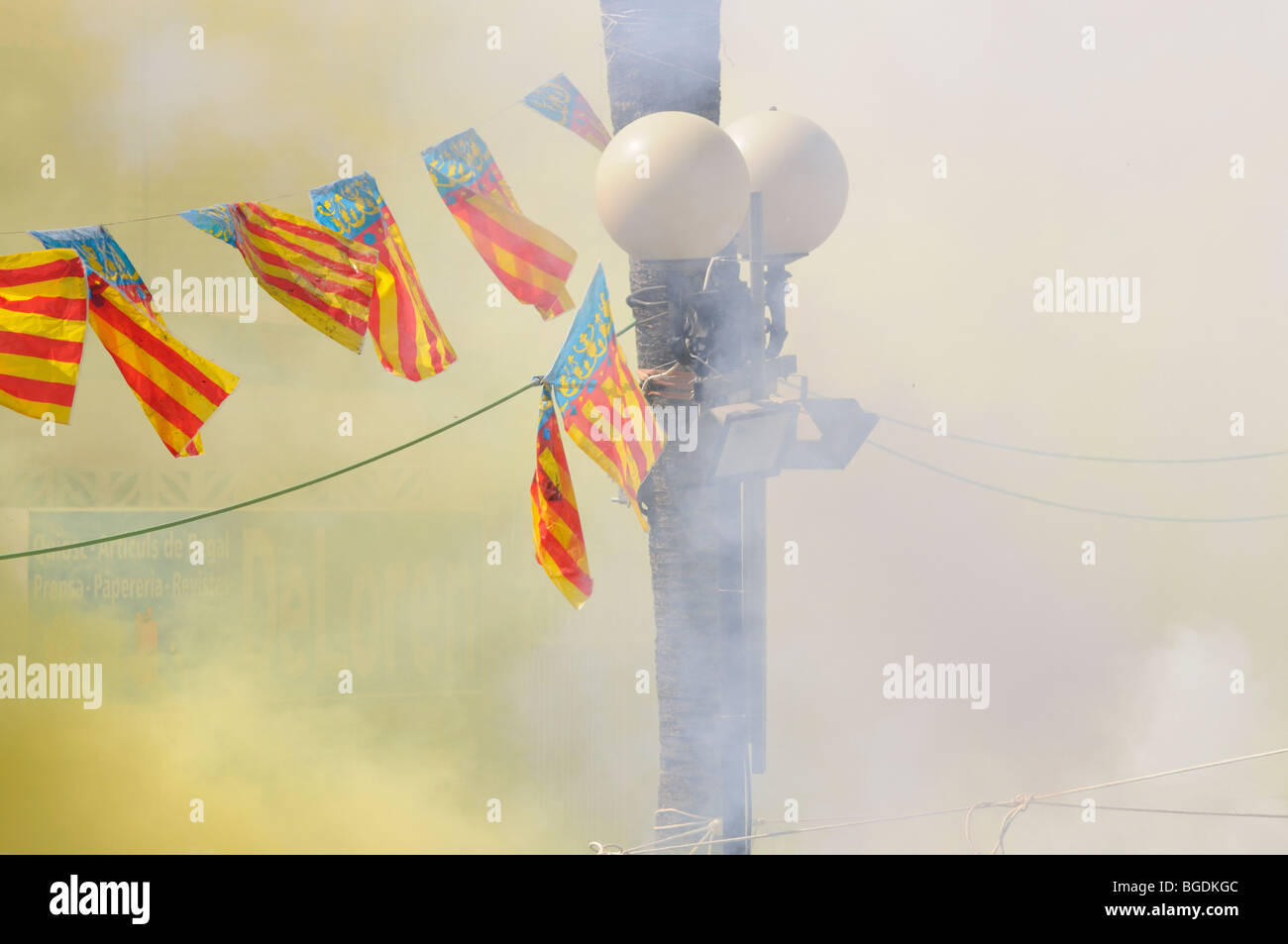 Flags and smoke in "La Mascletà" (fireworks display). "Les Falles" (in ...