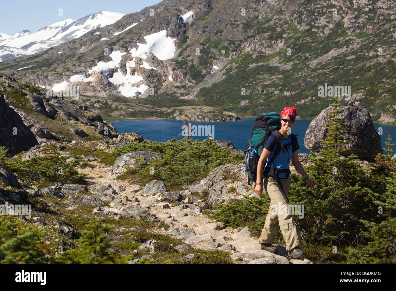 Young woman hiking, backpacking, hiker with backpack, historic Chilkoot ...