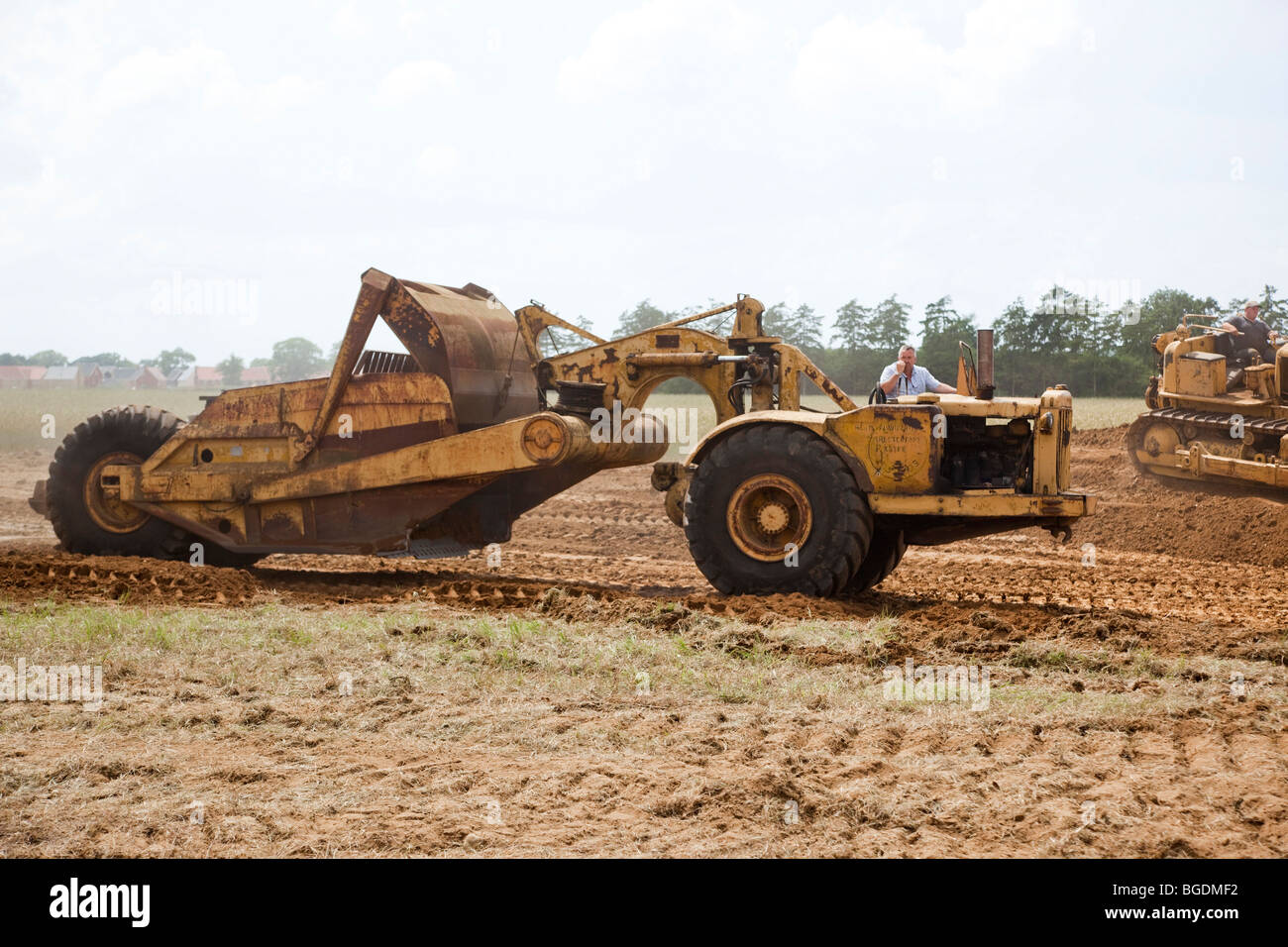 Caterpillar earth scrapper Stock Photo - Alamy