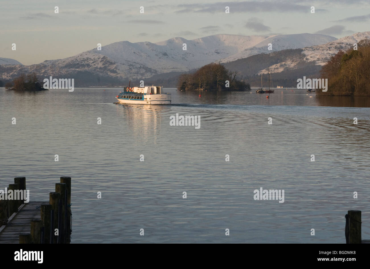 Lake Windermere in the Lake District in Winter with passenger ferry and ...