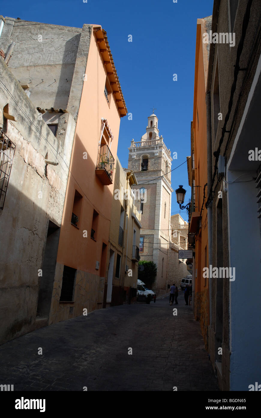 view along narrow village street to the church, mountain village of ...