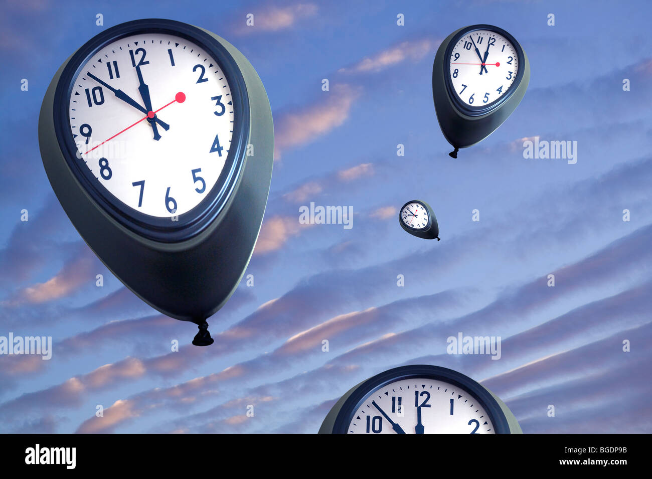 Clock balloons floating in the sky at dusk Stock Photo - Alamy