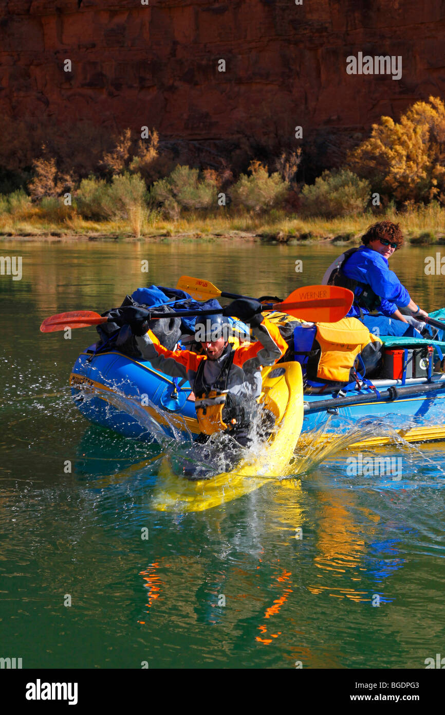 whitewater kayaker launching from raft in upper Grand Canyon, Arizona ...