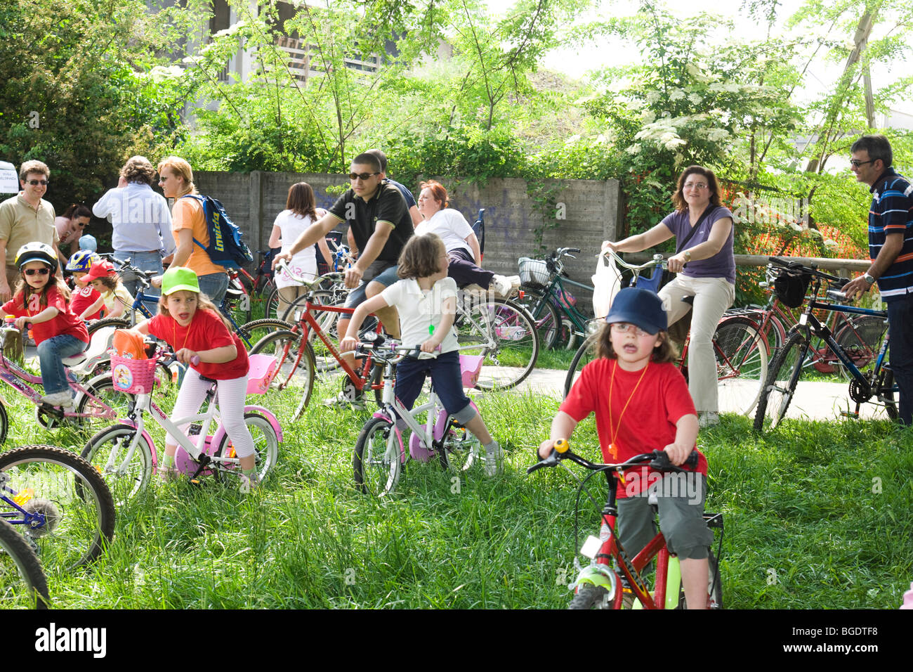 Children and parents having an excursion by bike together Stock Photo ...