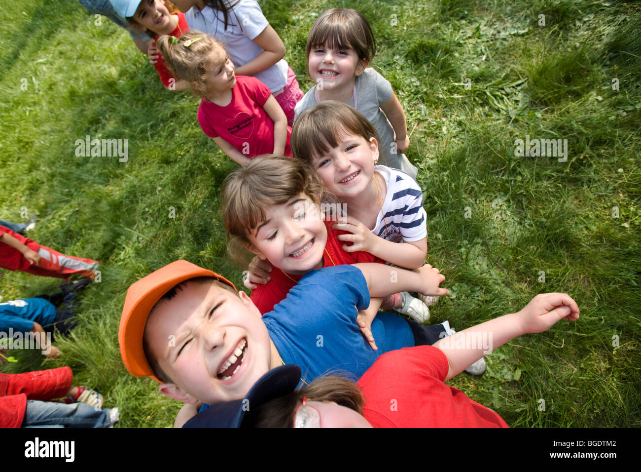 Group of Happy children in line outdoor Stock Photo - Alamy