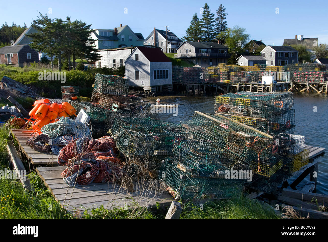 Lobster traps on the edge of Port Clyde Harbor in Maine Stock Photo - Alamy