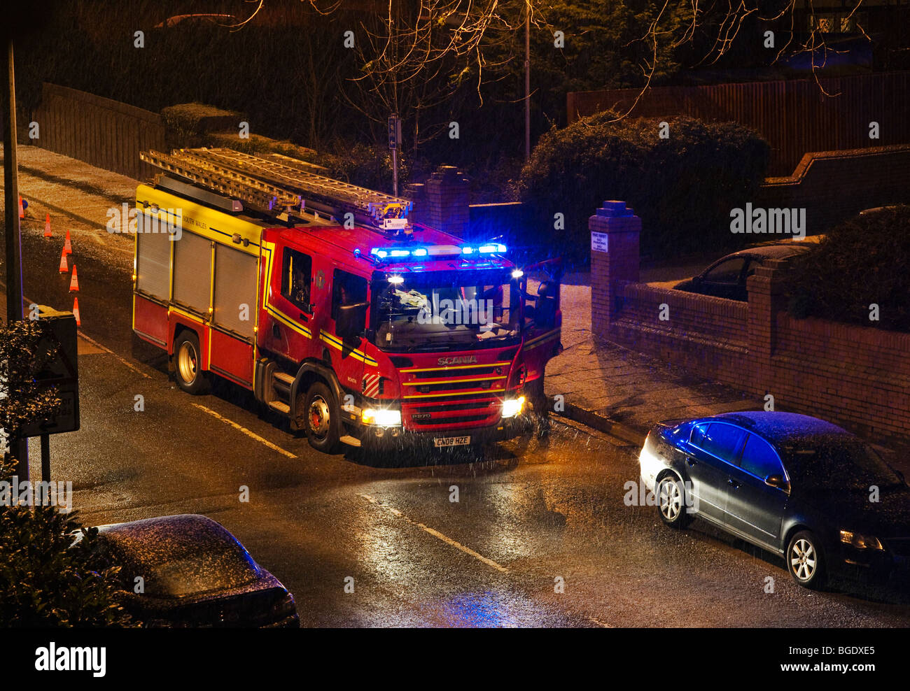 Fire engine in urban snow shower Stock Photo - Alamy