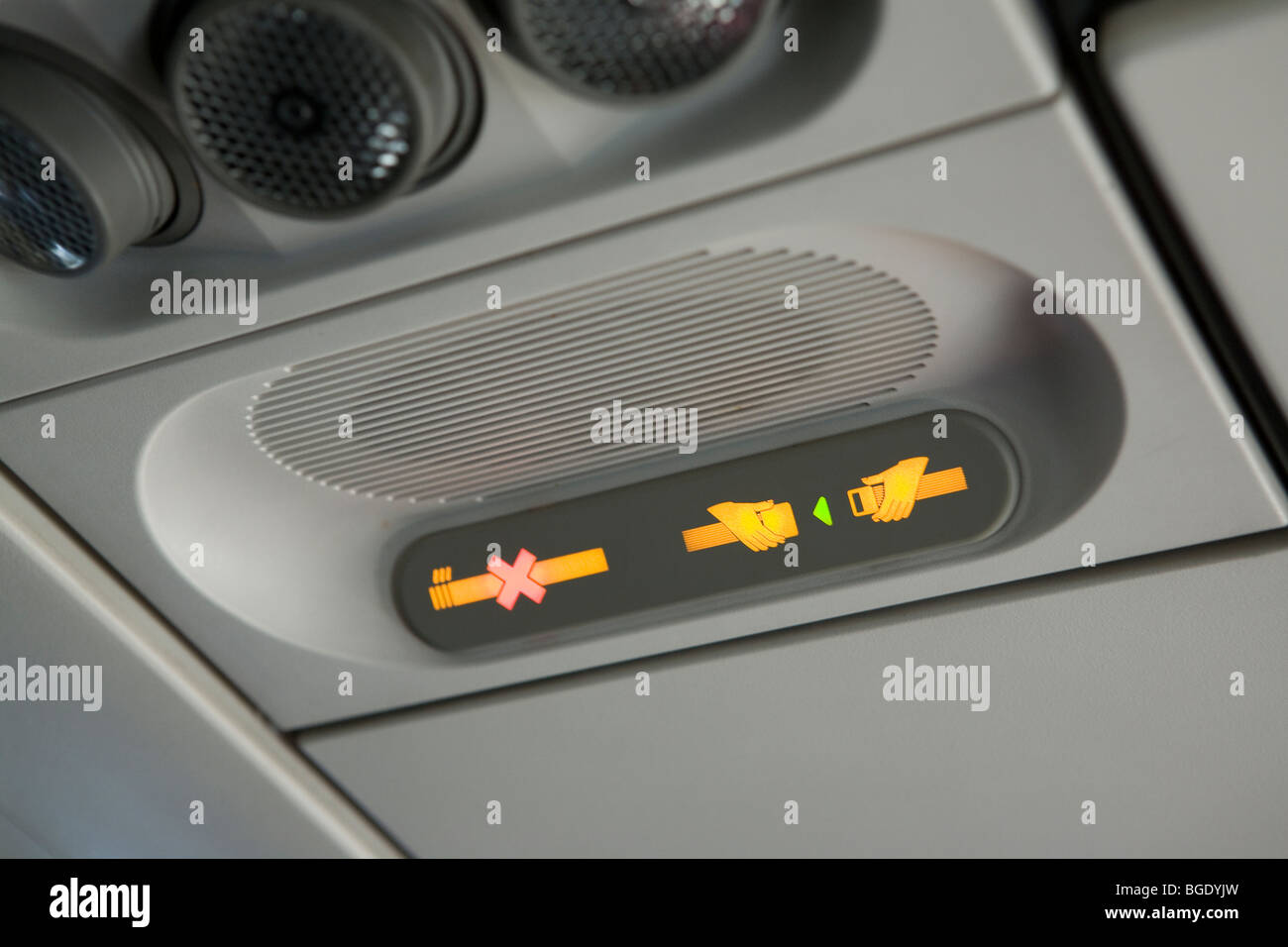 A no smoking and a fasten seat belt warning sign on an airplane Stock ...