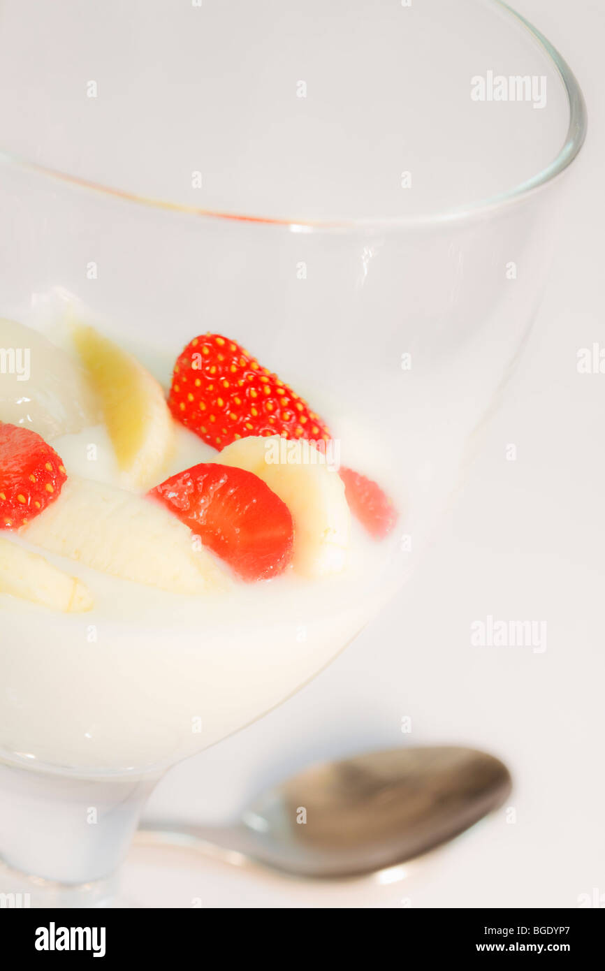 Bowl of yogurt with mixed fruit. Defocused. Isolated. Color Stock Photo ...