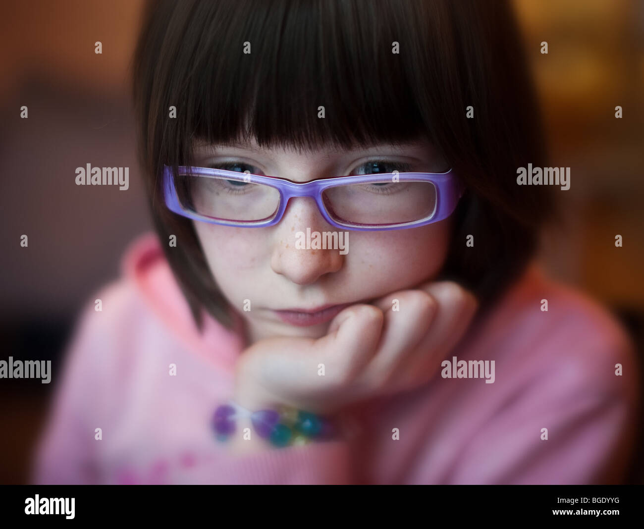 9 year old girl concentrates on computer screen Stock Photo - Alamy