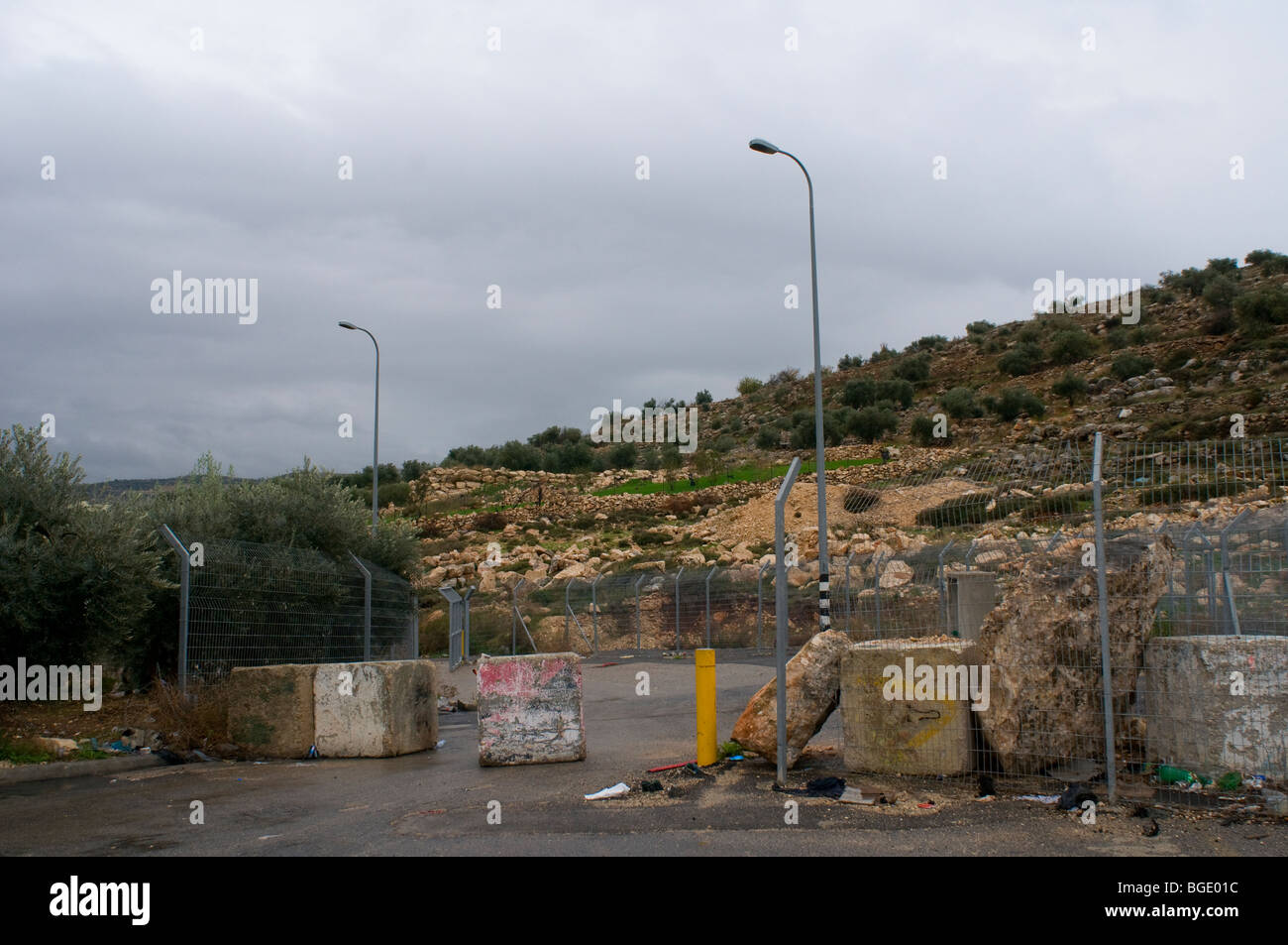 Physical obstacles between a road leading to a Palestinian village and ...