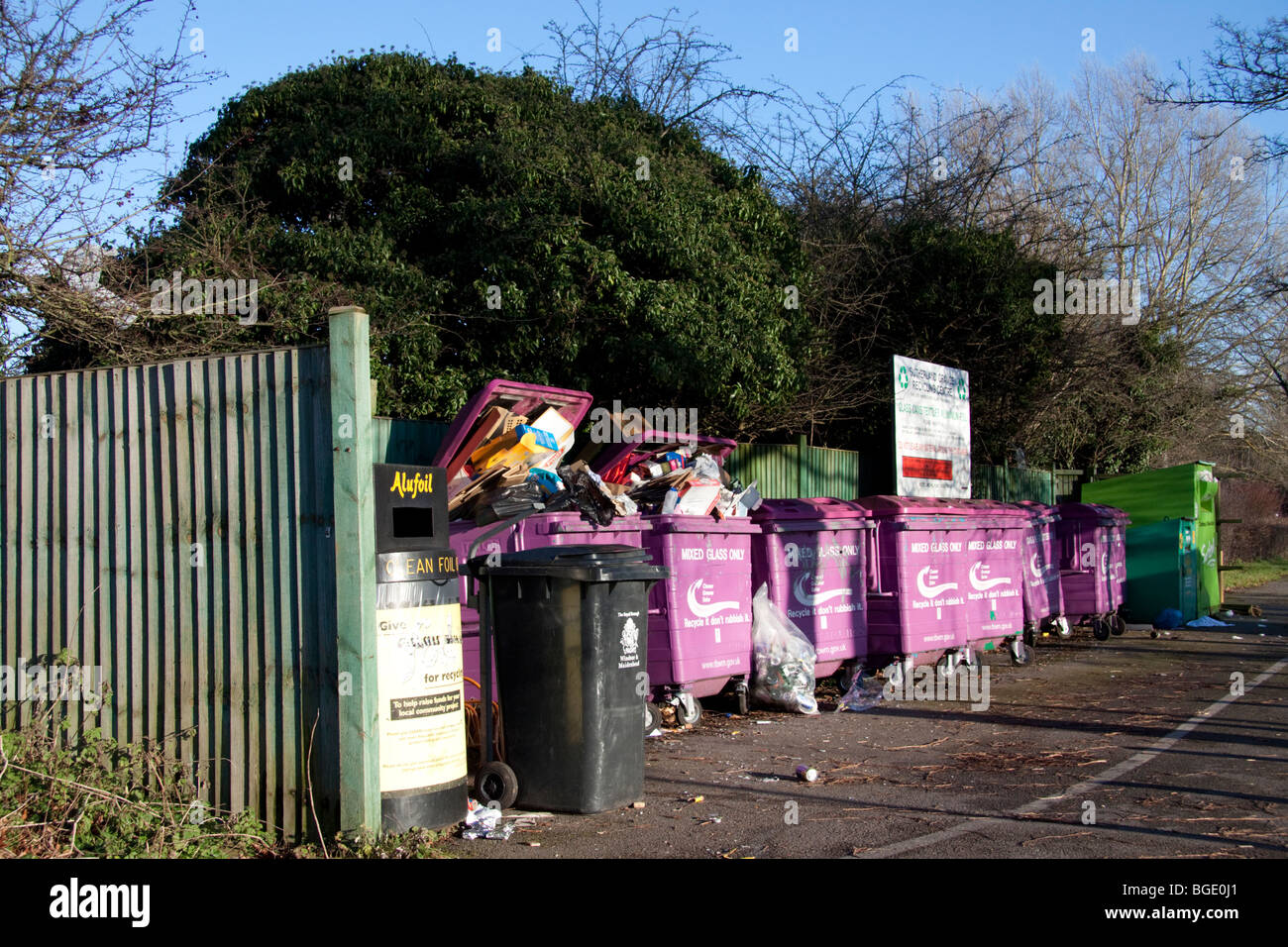 Overflowing recycling bins filled with the wrong rubbish. Bins marked ...