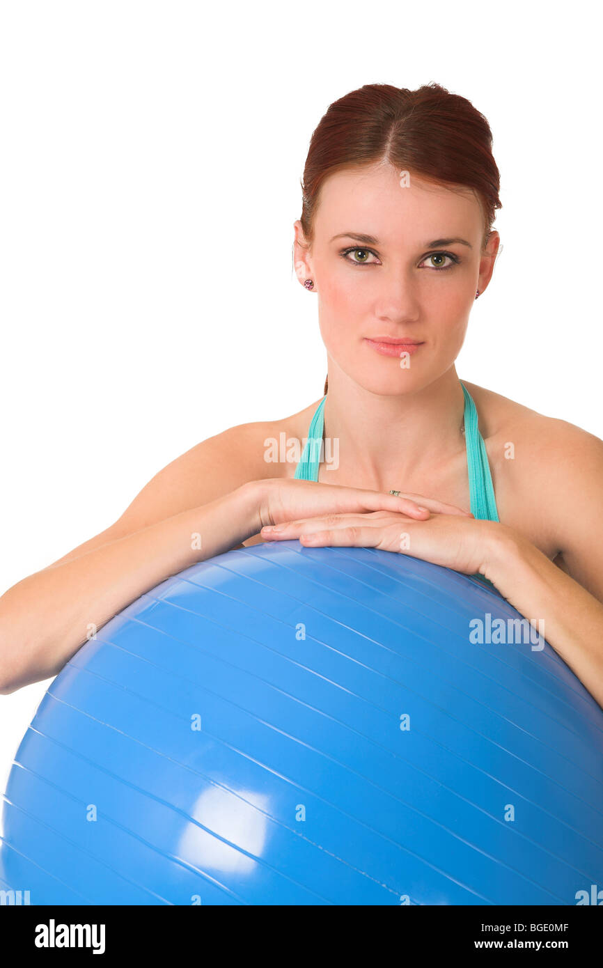 Woman sitting with blue gym ball Stock Photo - Alamy