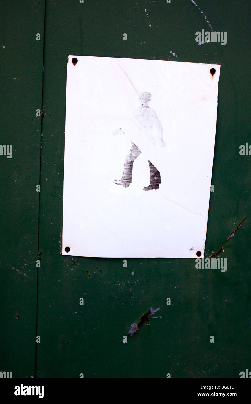 Faded warning sign pinned to wall UK Stock Photo - Alamy
