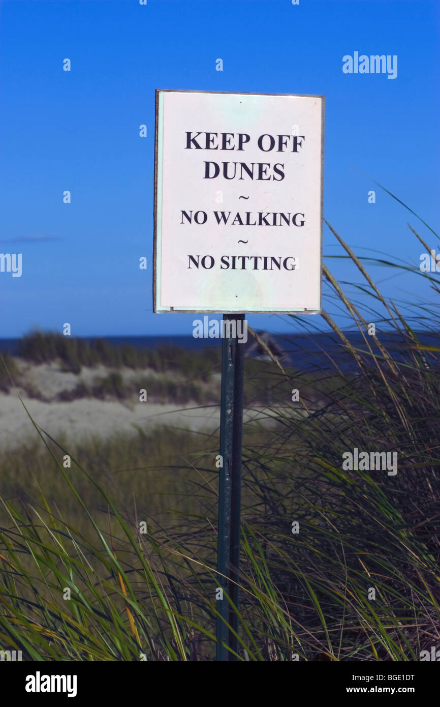 keep off dunes sign - no sitting - no walking Stock Photo - Alamy