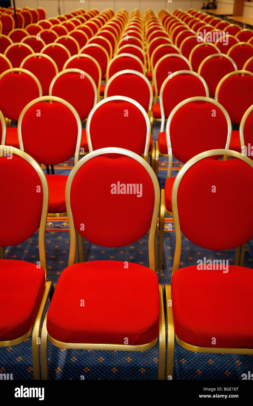 conference hall with red chairs in rows Stock Photo - Alamy