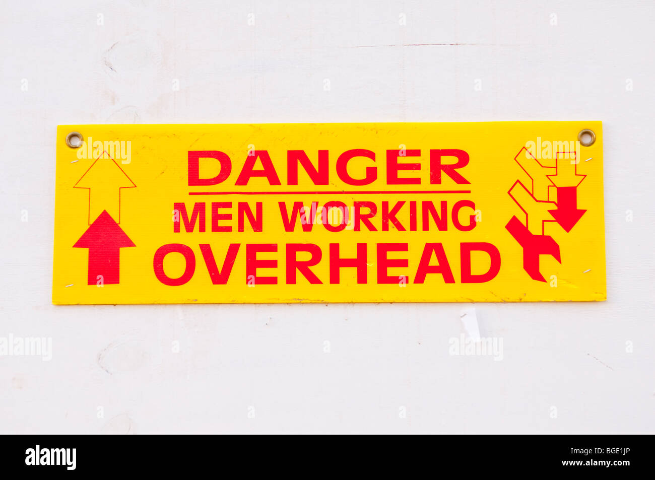 A sign reading Danger men working overhead Stock Photo - Alamy