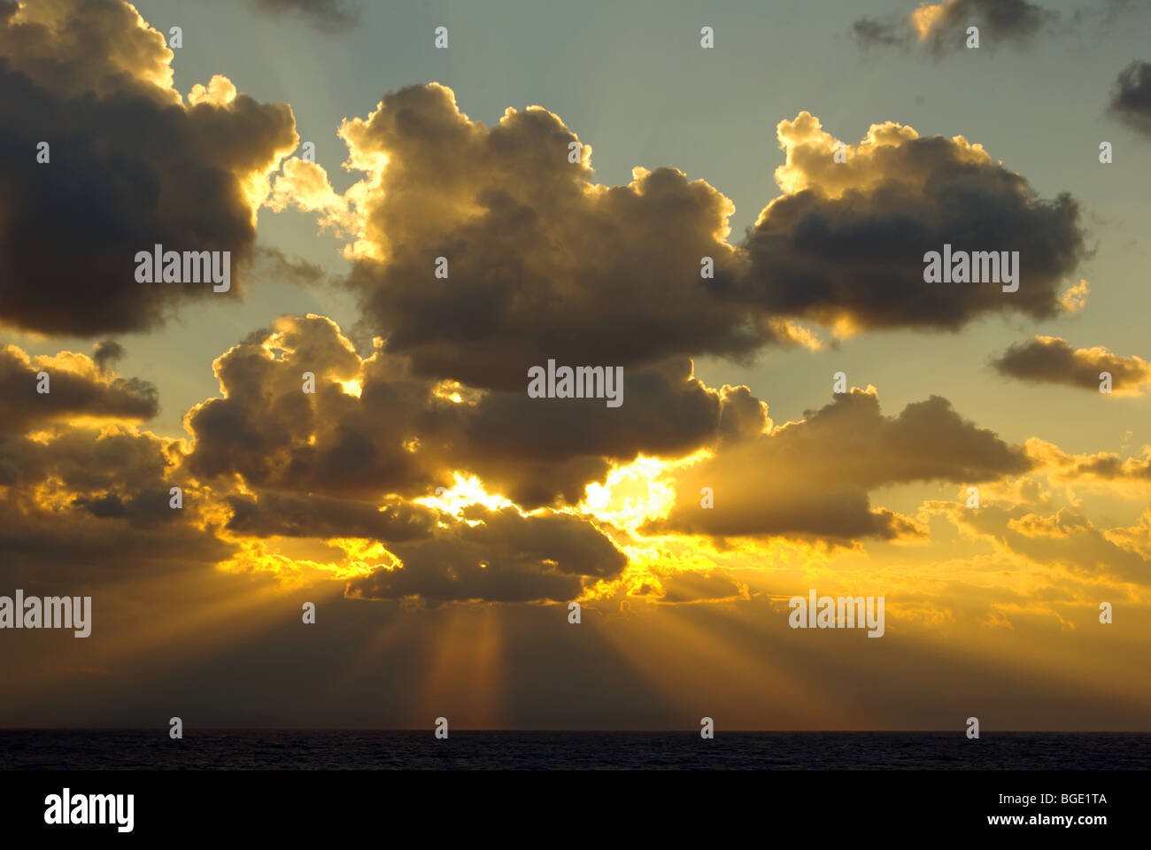 Sun rays bursting through clouds hi-res stock photography and images ...