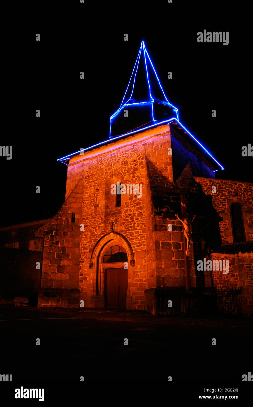 Stock photo of a French Village Church lit up with Christmas lights ...