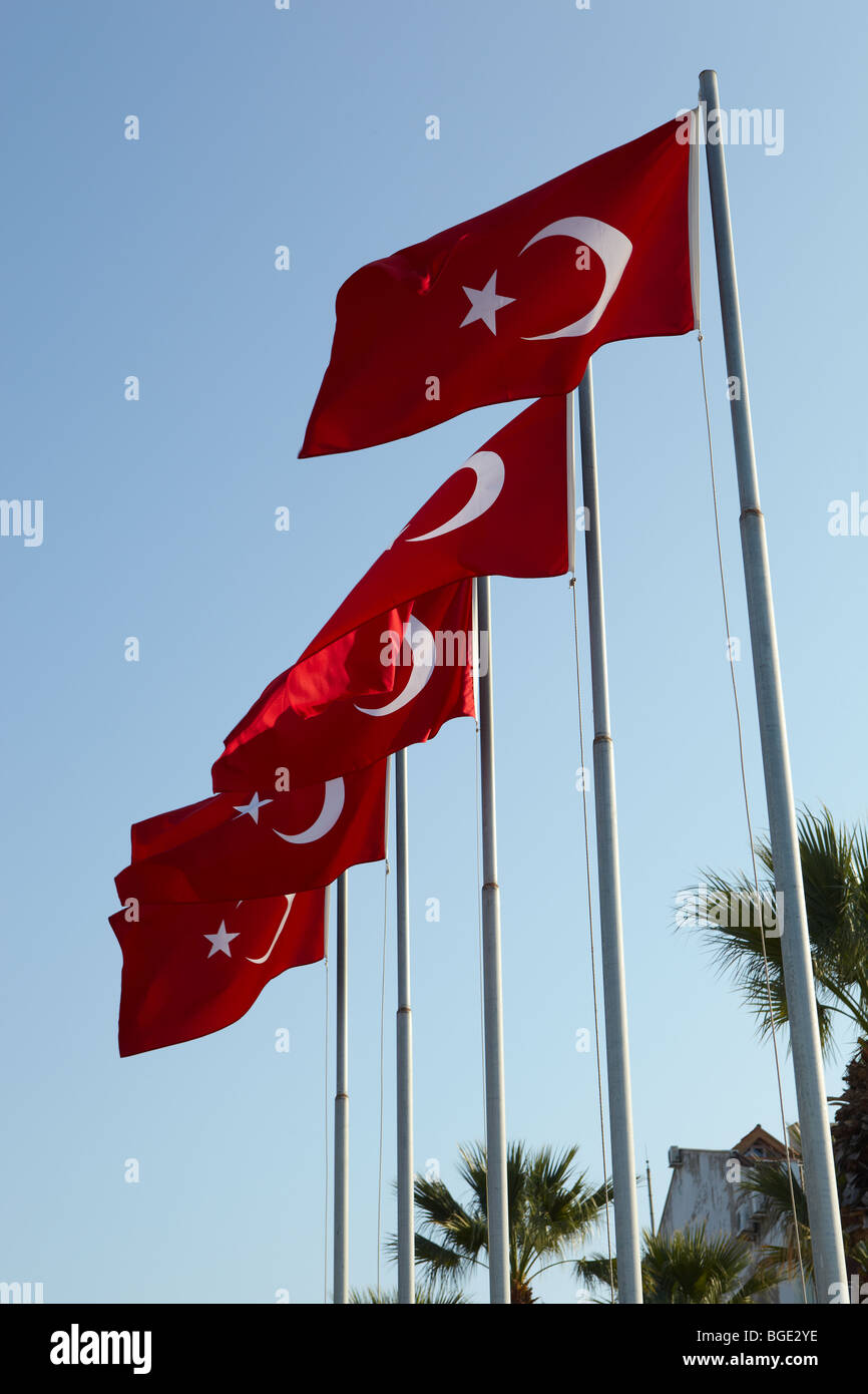 Red turkish flags blowing in the wind on a clear blue sky day Stock ...