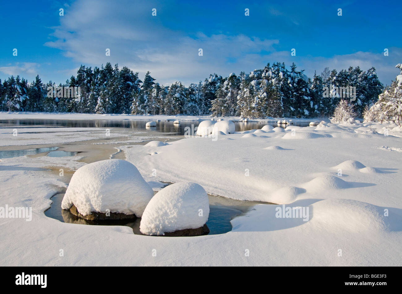 Heavy Winter snowfall at Loch Morlich in the Cairngorms National Park ...