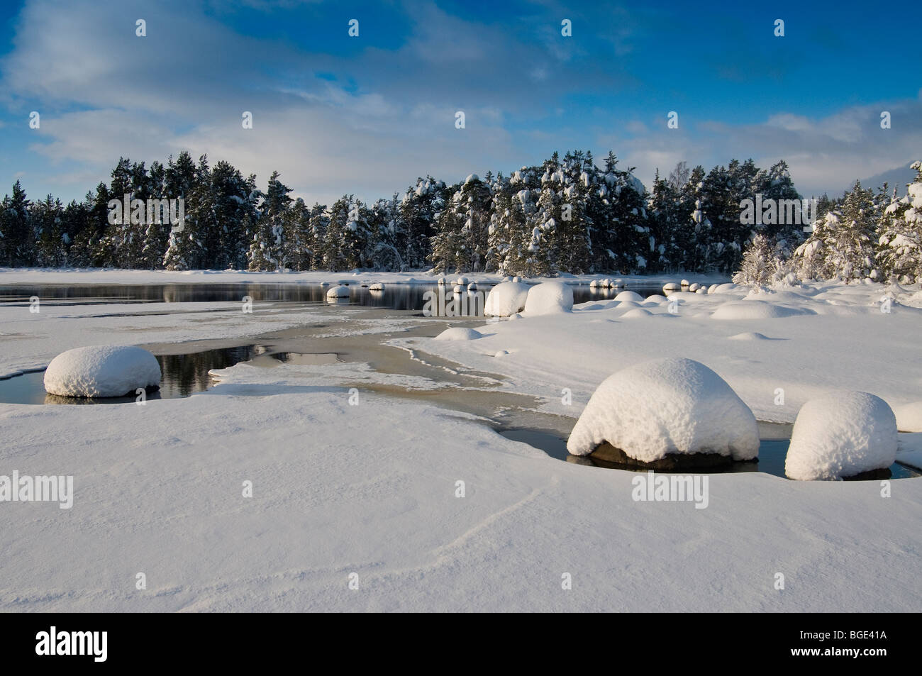 Heavy Winter snowfall at Loch Morlich in the Cairngorms National Park ...