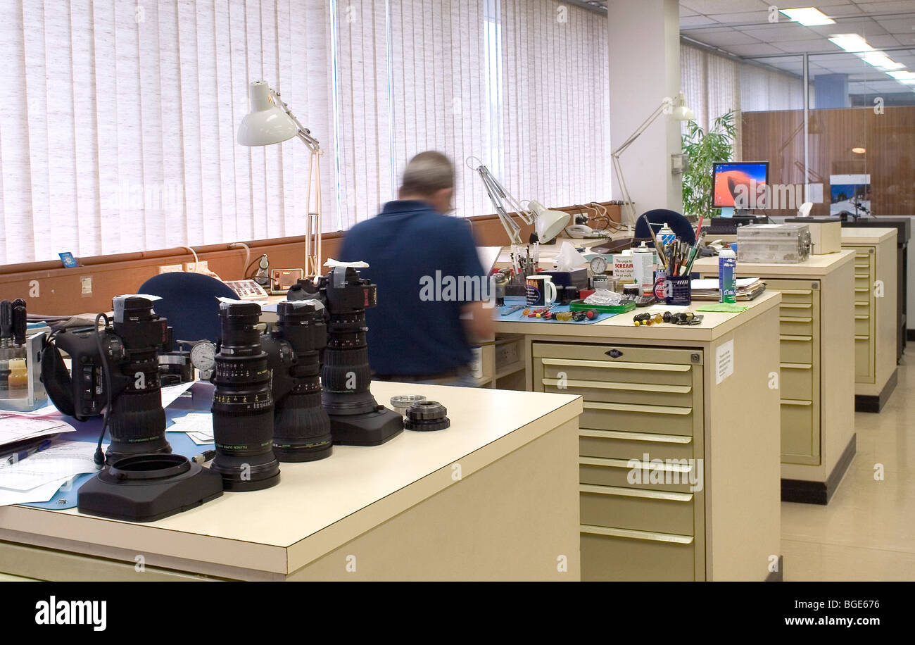 Interior of a lens and camera workshop with technician Stock Photo - Alamy