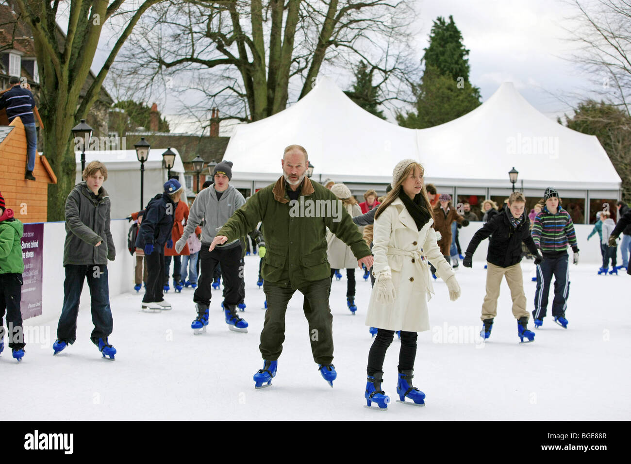 People of all ages ice skating at an outdoor rink Stock Photo - Alamy