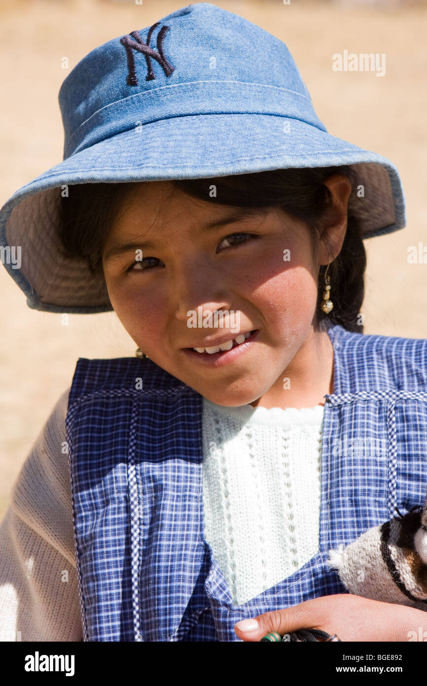 Portrait of young Bolivian girl on Moon Island in Lake Titicaca ...