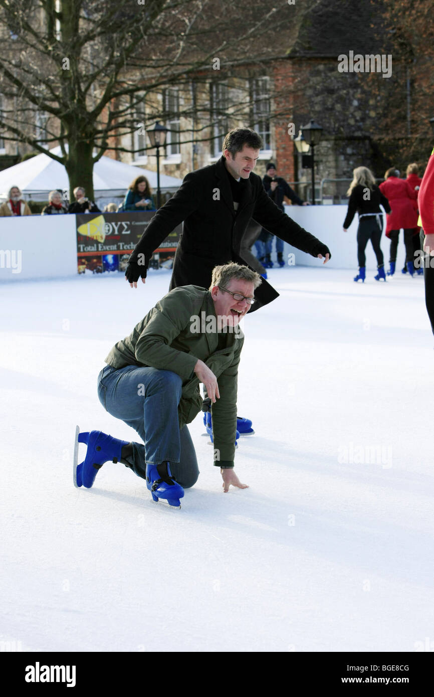 A man getting himself back on his feet after falling whilst People of ...